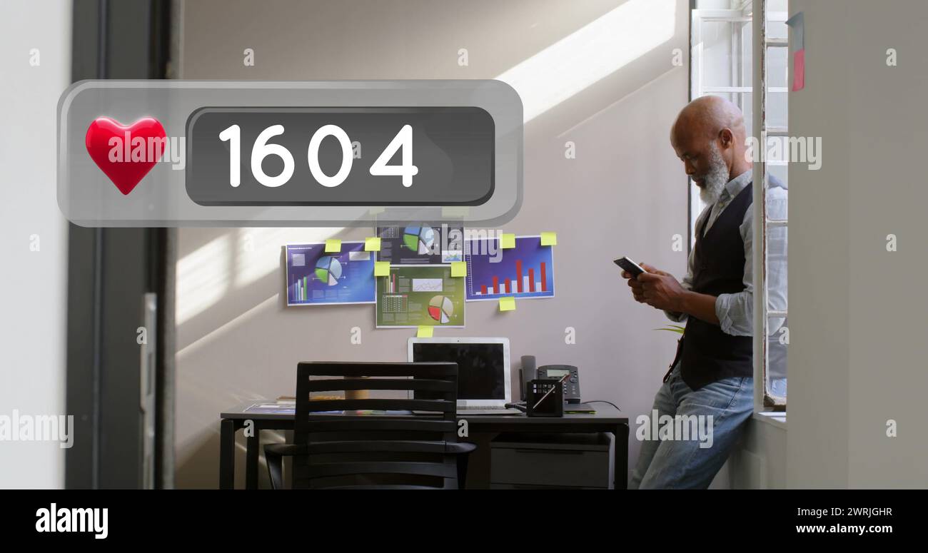 Side view of a Caucasian man sitting on a window sill next to a ...