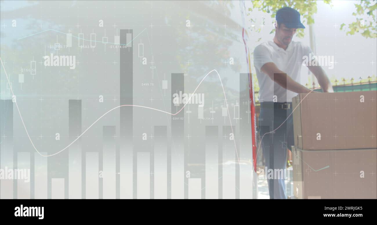 Low angle of a male Caucasian worker unloading packages on a trolley ...