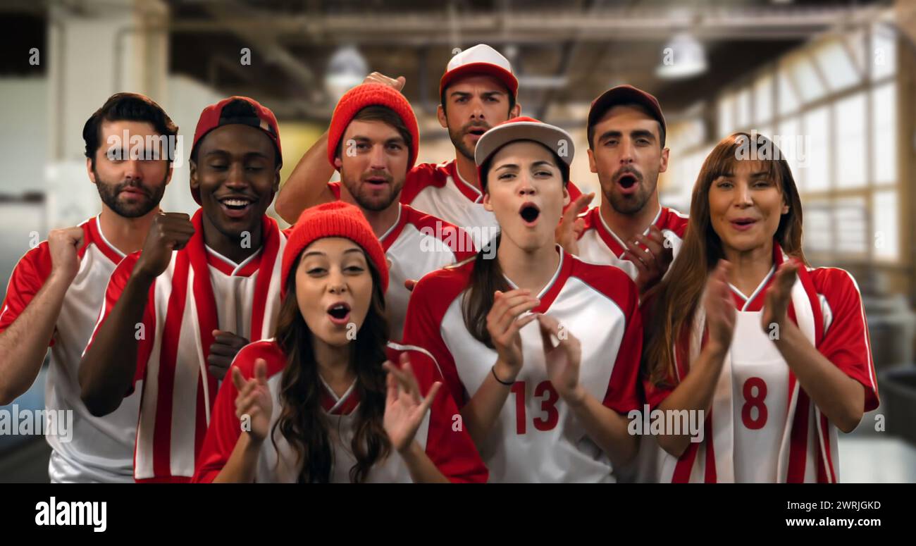 Front view of a group of sports fans wearing red and white jerseys ...