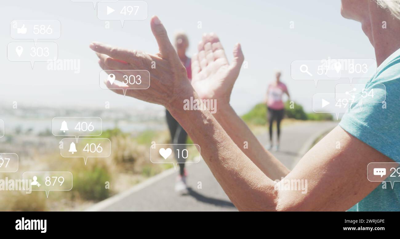 Image of social media notifications, over woman clapping women running ...