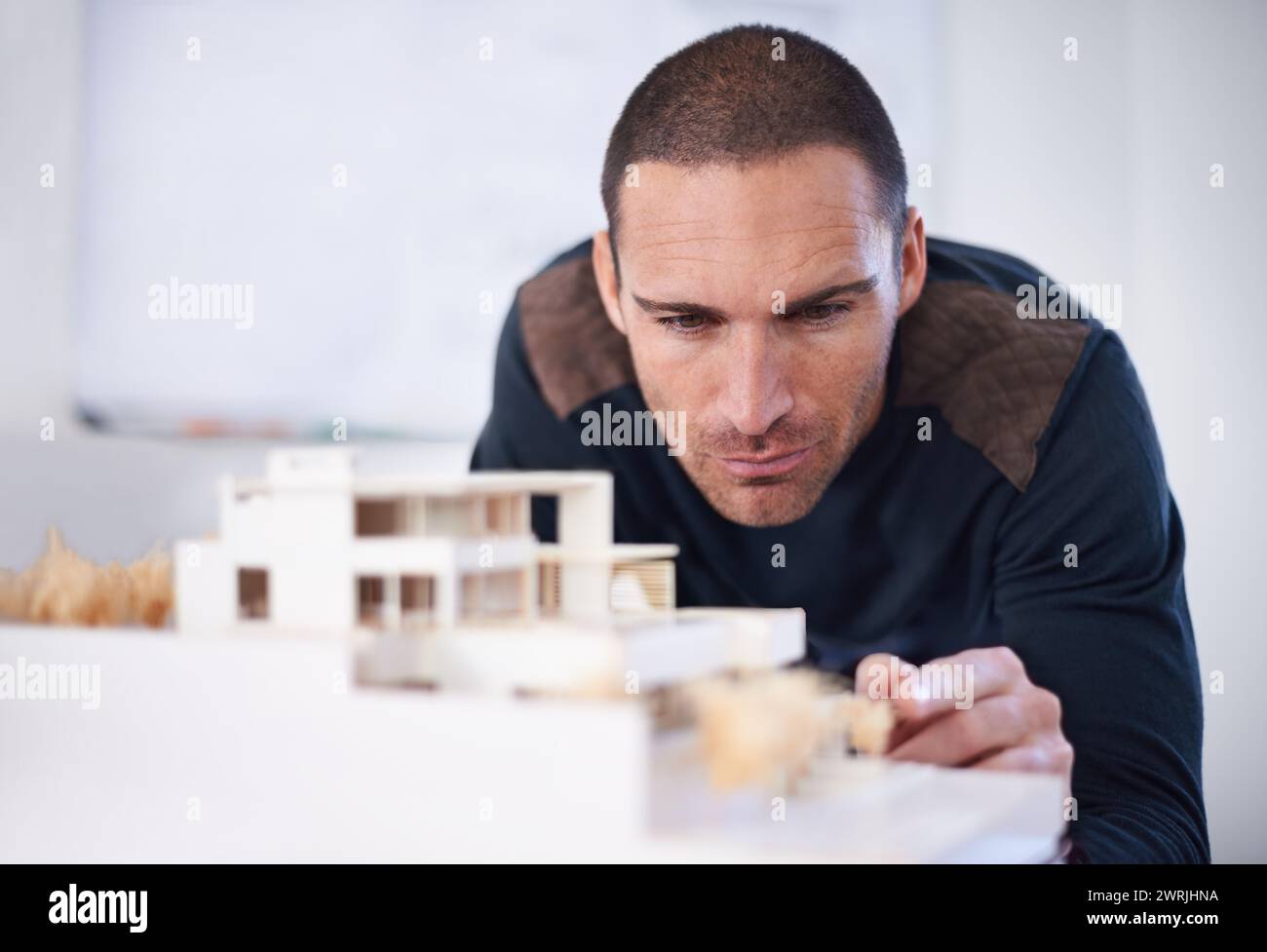 Man, architecture and model building or planning house renovation or 3d ...