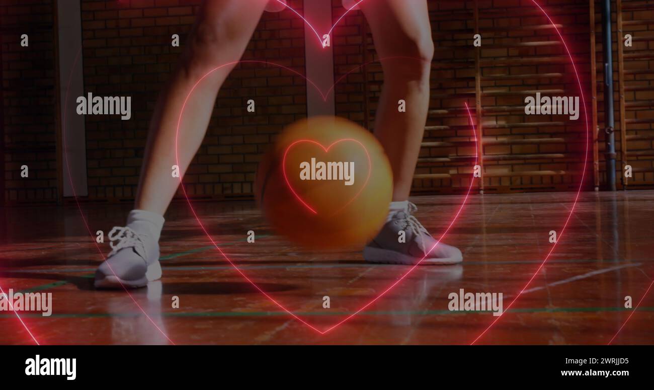 Image of neon hearts over caucasian female basketball player bouncing ...