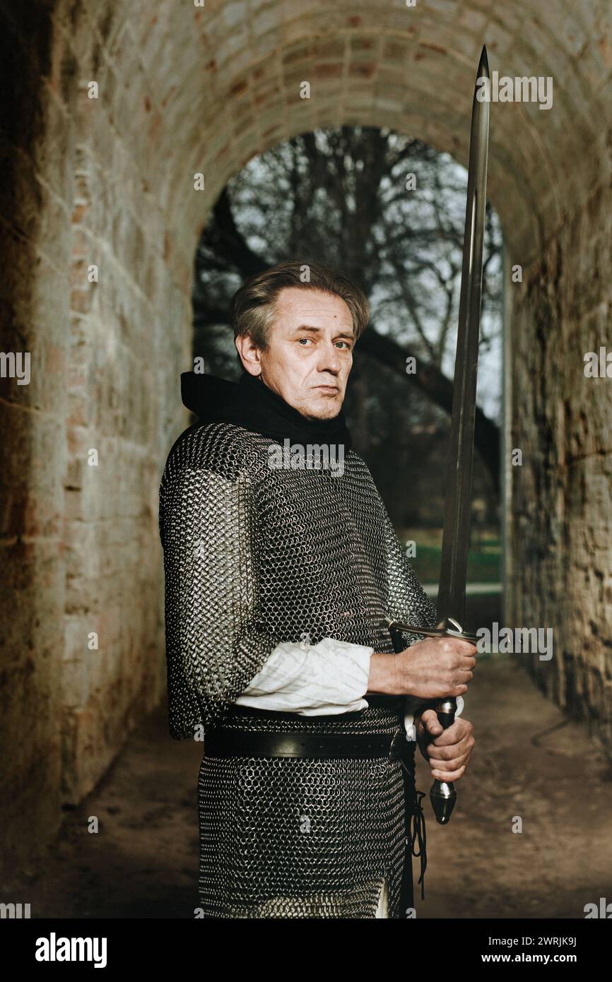 Medieval infantry armed man on guard in castle gateway Stock Photo - Alamy