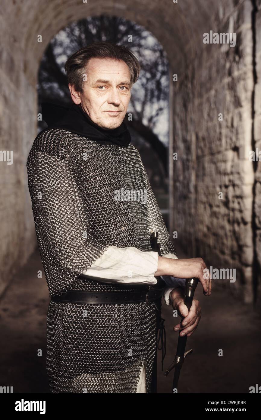 Medieval infantry armed man on guard in castle gateway Stock Photo - Alamy