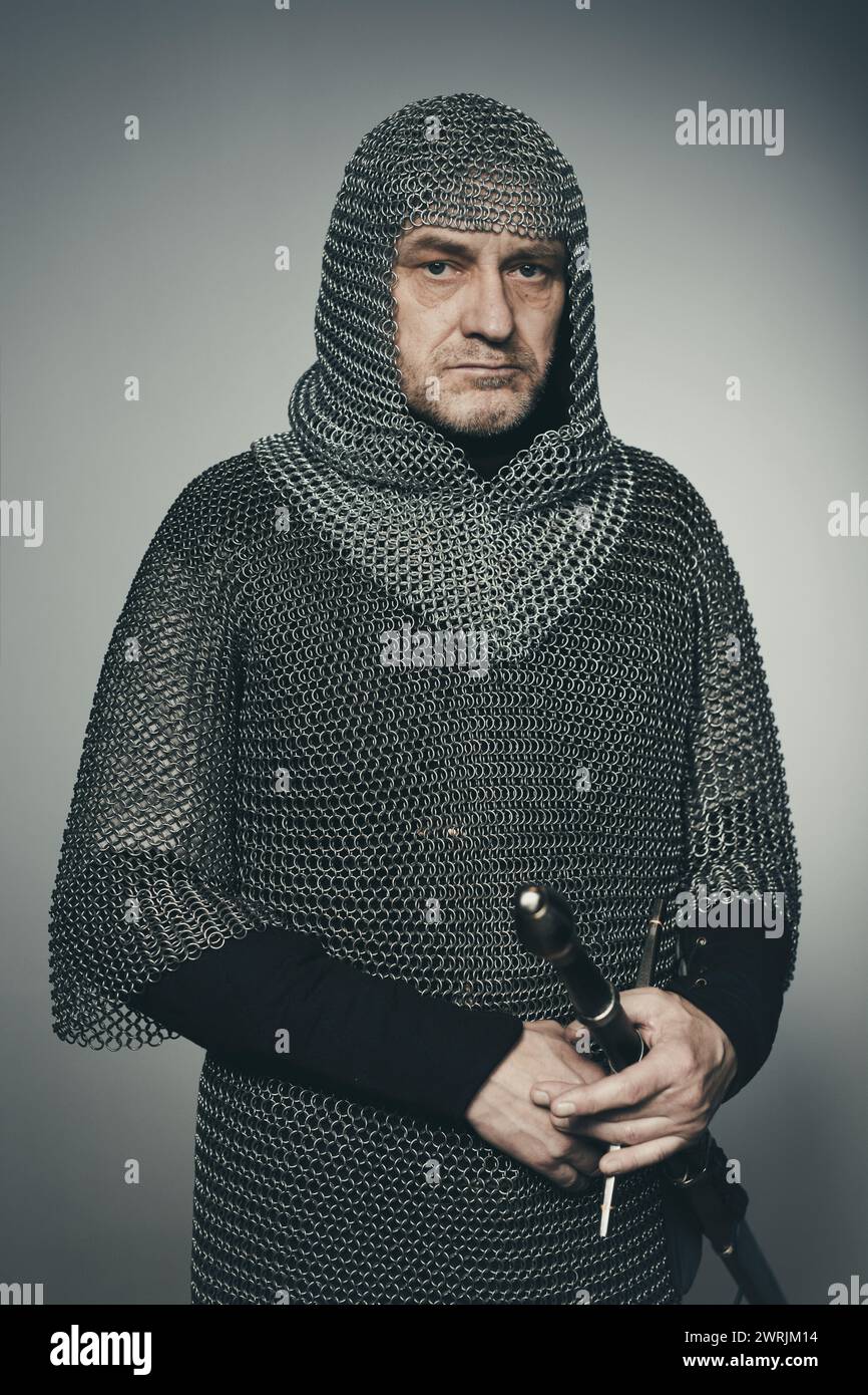 Medieval infantry armed man dressed in chain armor Stock Photo - Alamy