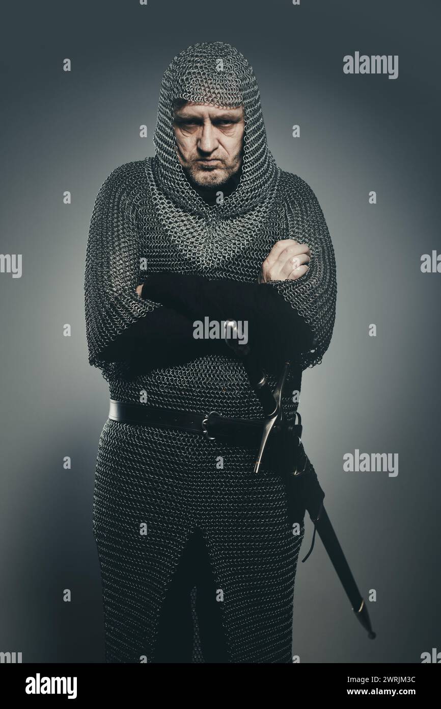 Medieval infantry armed man dressed in chain armor Stock Photo - Alamy