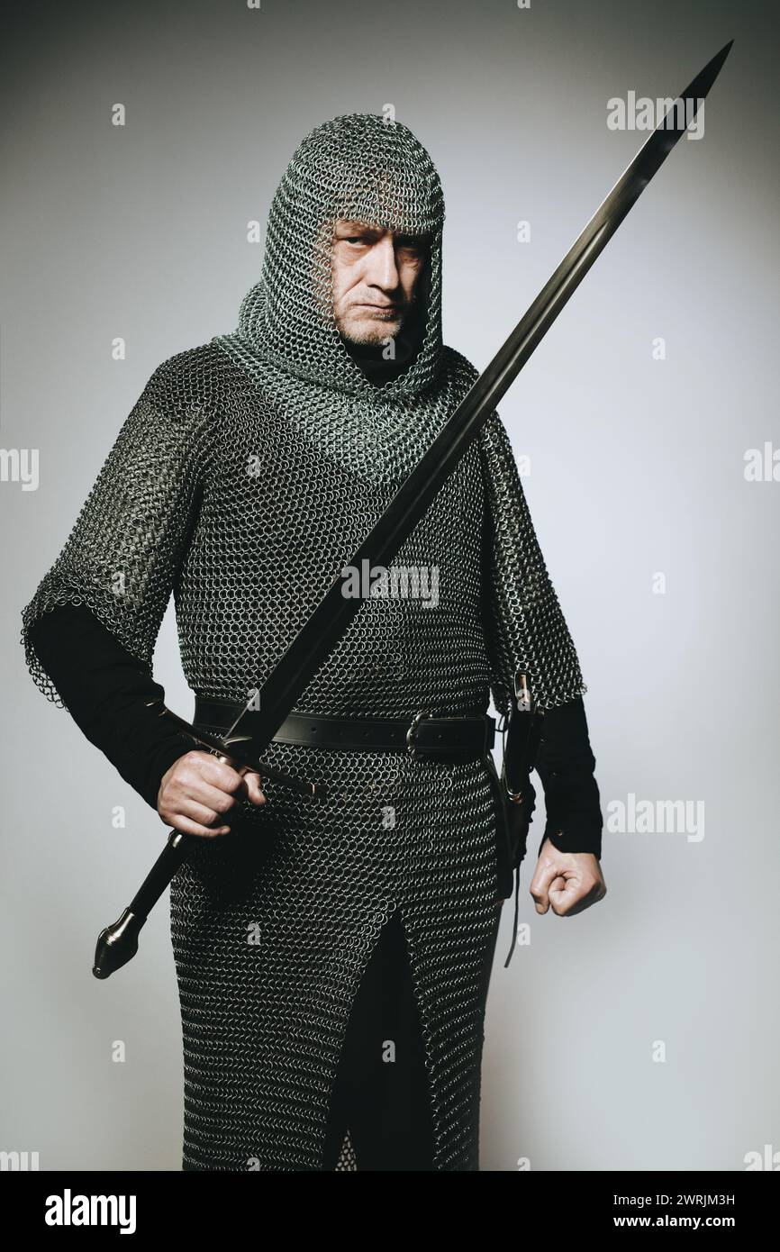 Medieval infantry armed man dressed in chain armor Stock Photo - Alamy