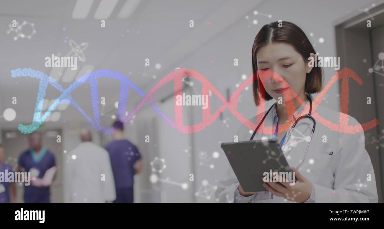 Image of dna strand and molecules over asian female doctor using tablet ...