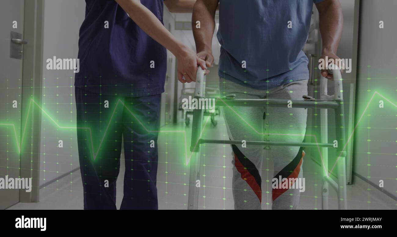 Image of vital signs monitor over diverse female doctor and male ...