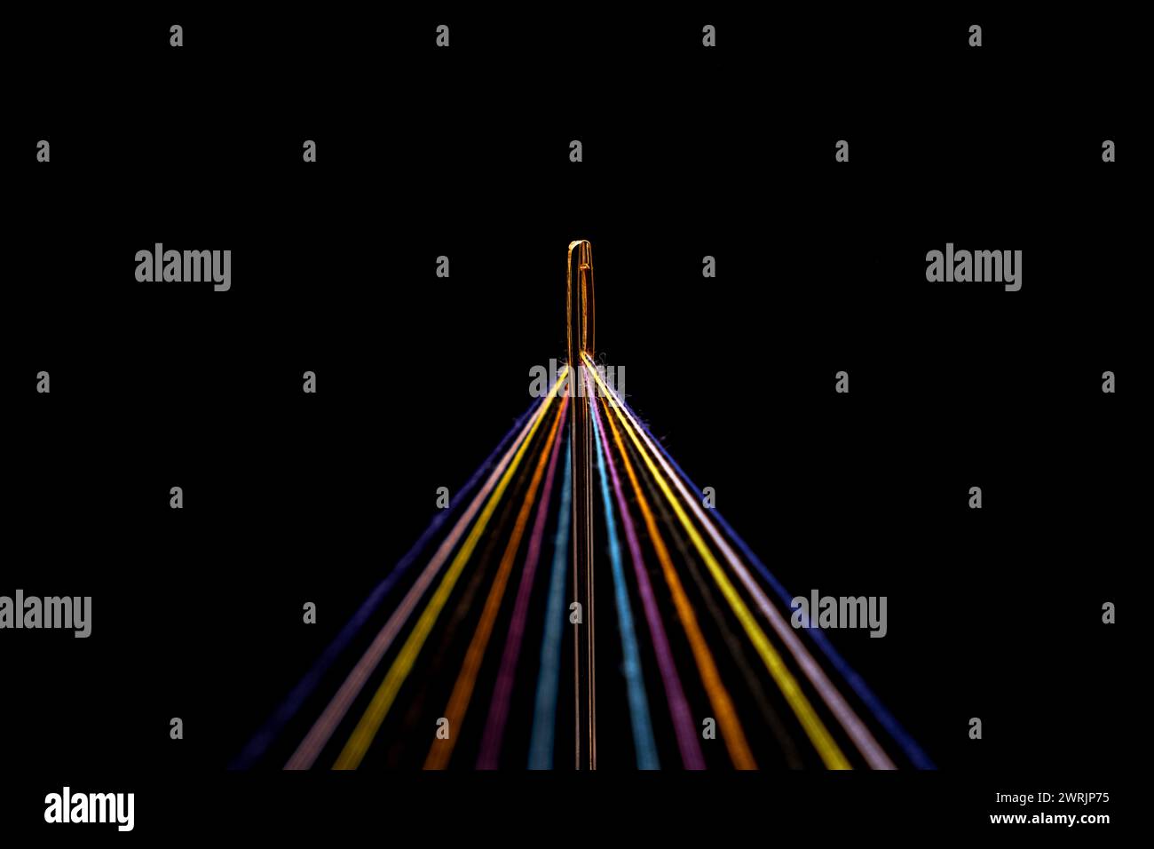Rainbow Colored Threads Through Needle Eyelet Stock Photo - Alamy