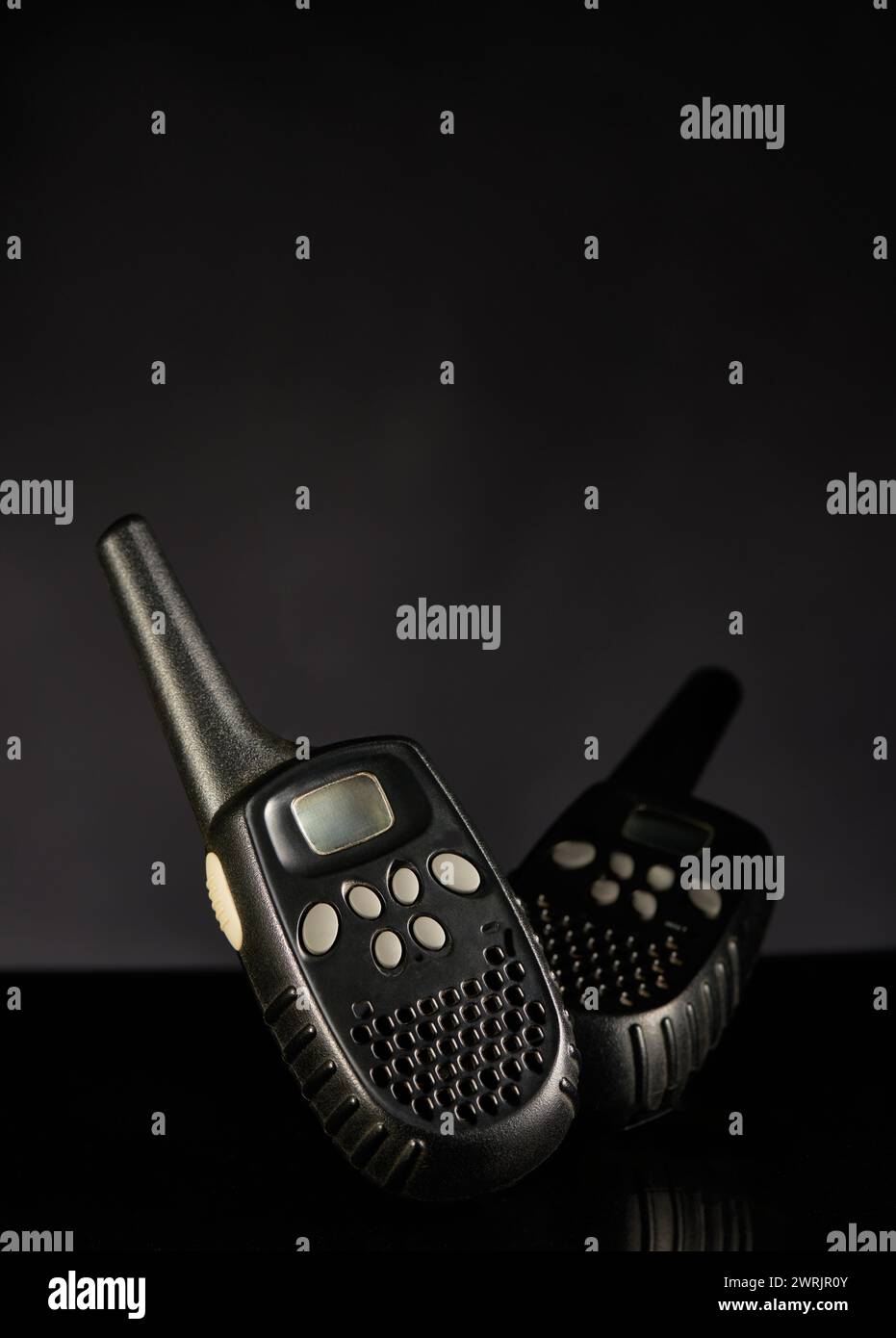 Different angles of black walkie talkie with gray keypad isolated on ...