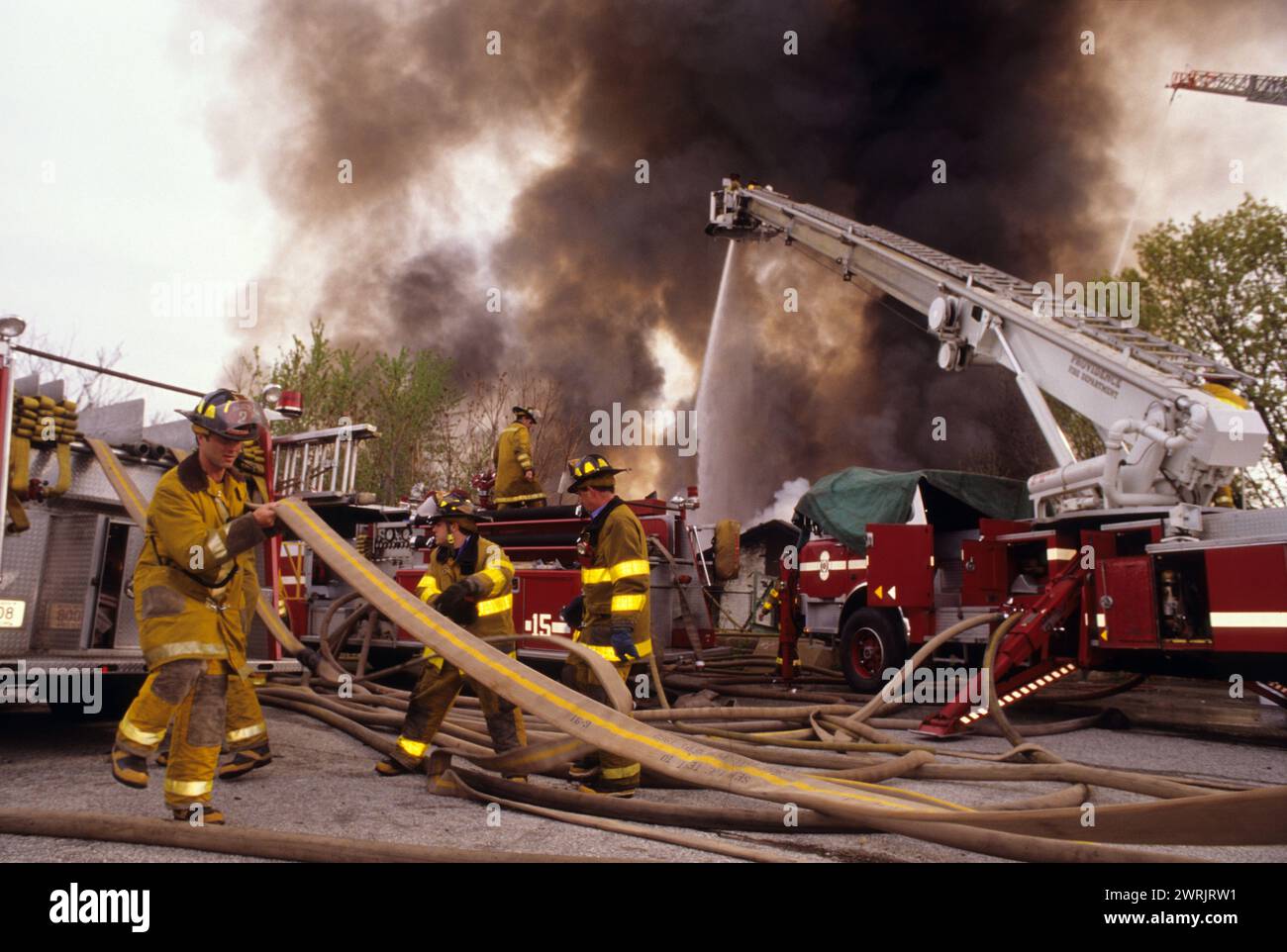 USA firemen fire trucks in action big fire wharehouse insurance ...