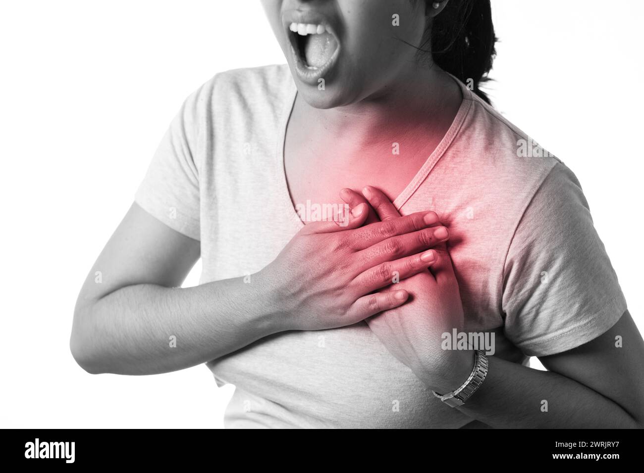 An Indian woman holding her chest for pain showing painful expression ...