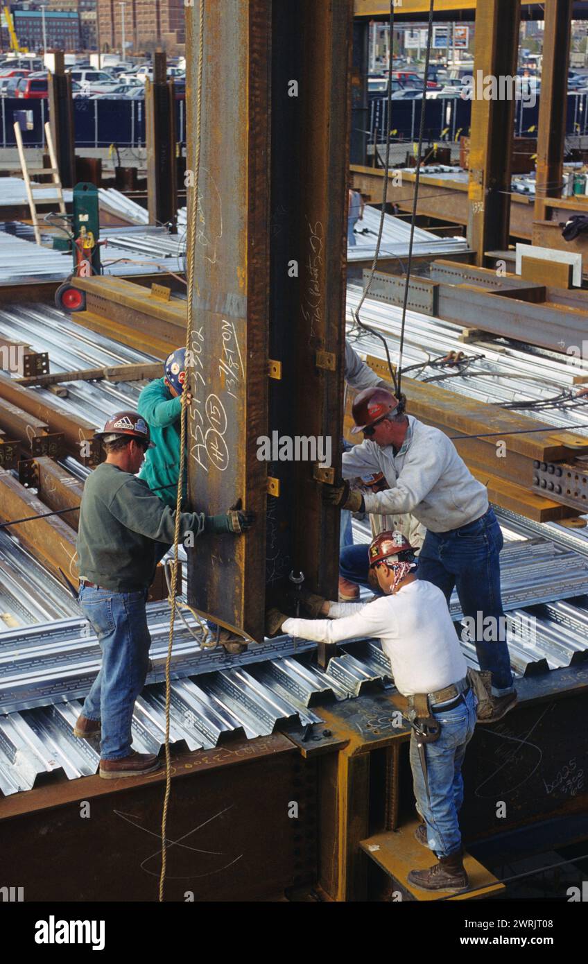 iron workers placing piece of iron to build building in Boston ...