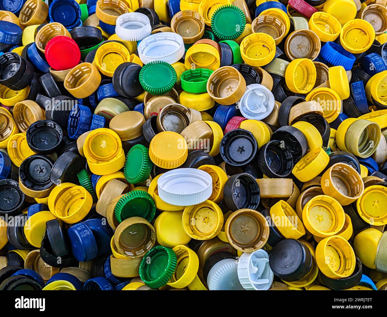 Lots of different plastic bottle caps. Garbage sorting Stock Photo - Alamy