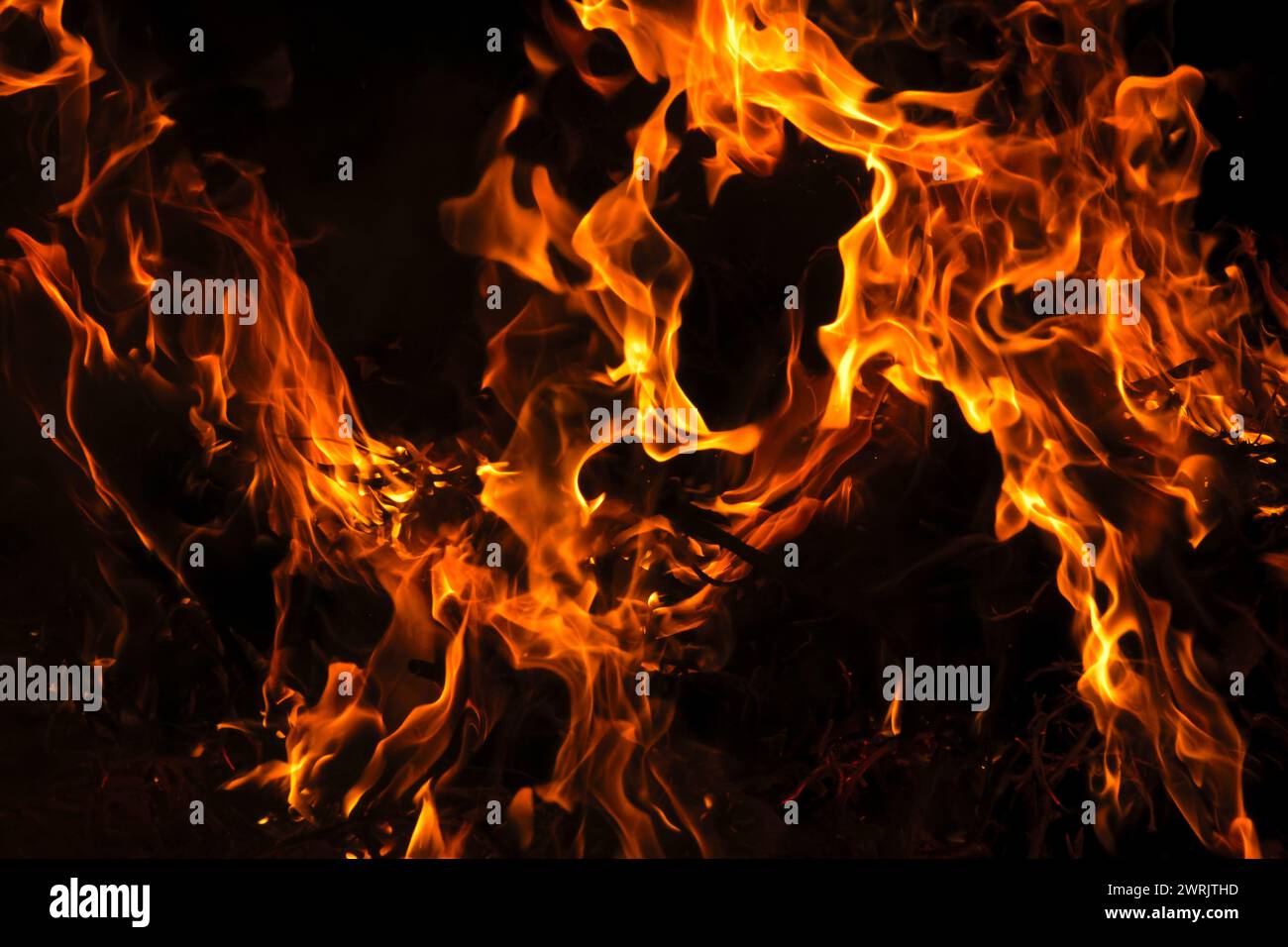 A Intense fire with black background, with space for text Stock Photo ...