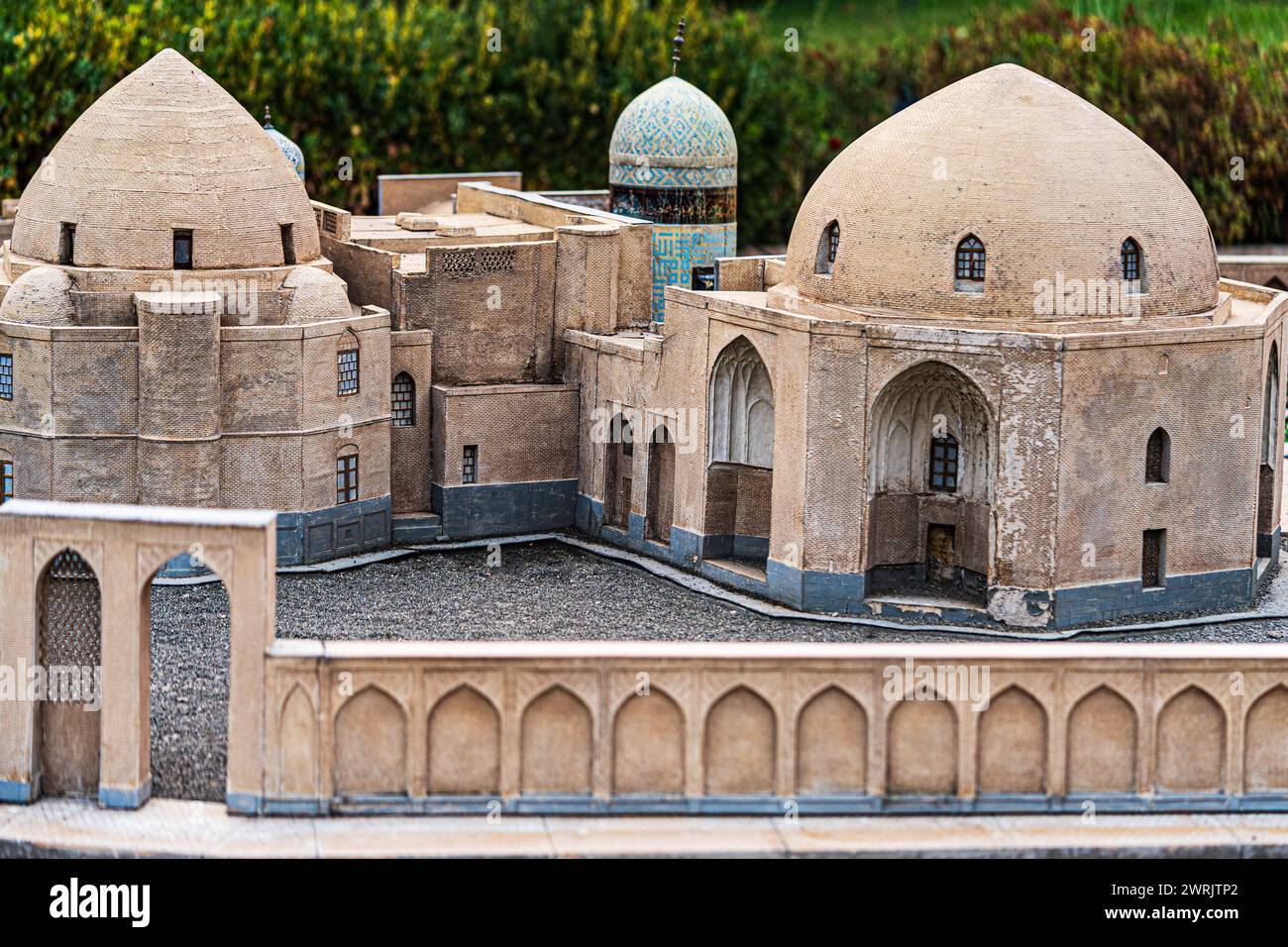 A miniature mosque set against a detailed courtyard and structure Stock ...
