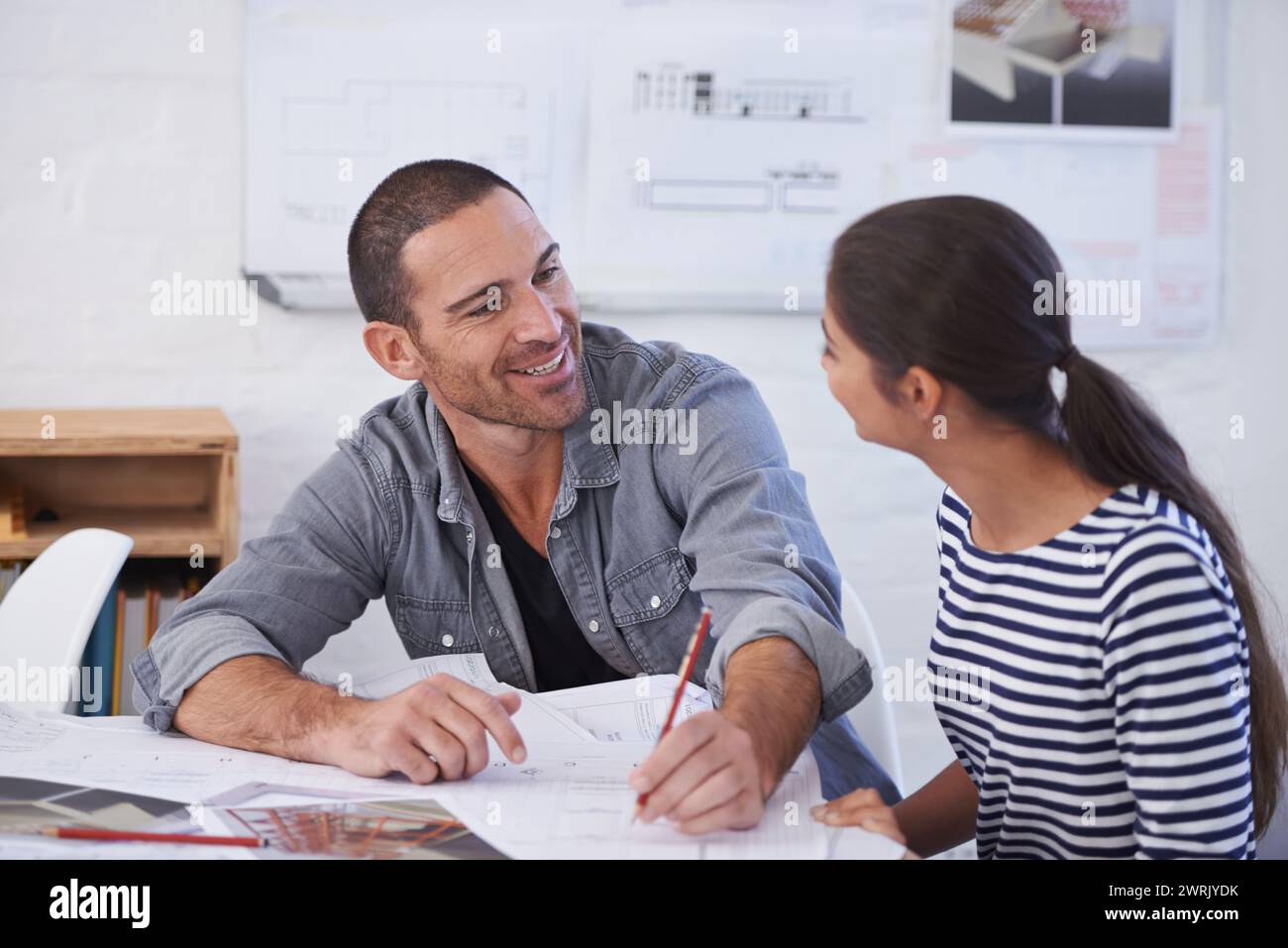 Man, woman and architecture teamwork with blueprint drawing for project ...