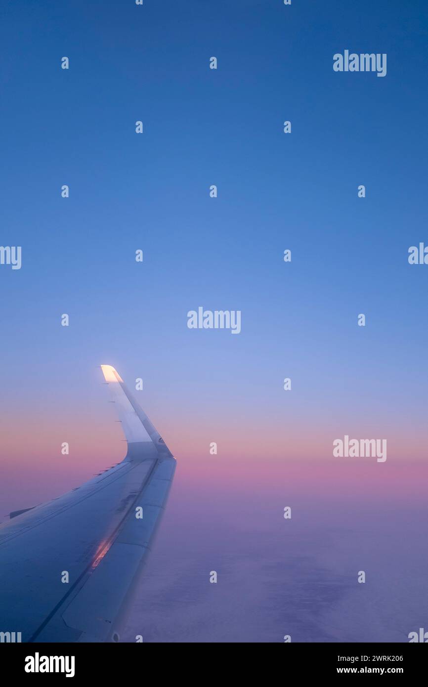 Airplane flying over a snowy landscape in Rovaniemi, Finland on a ...