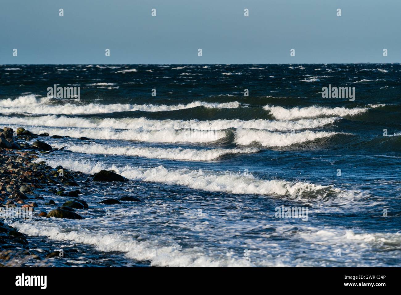 Storm waves roll onto rocky hi-res stock photography and images - Alamy