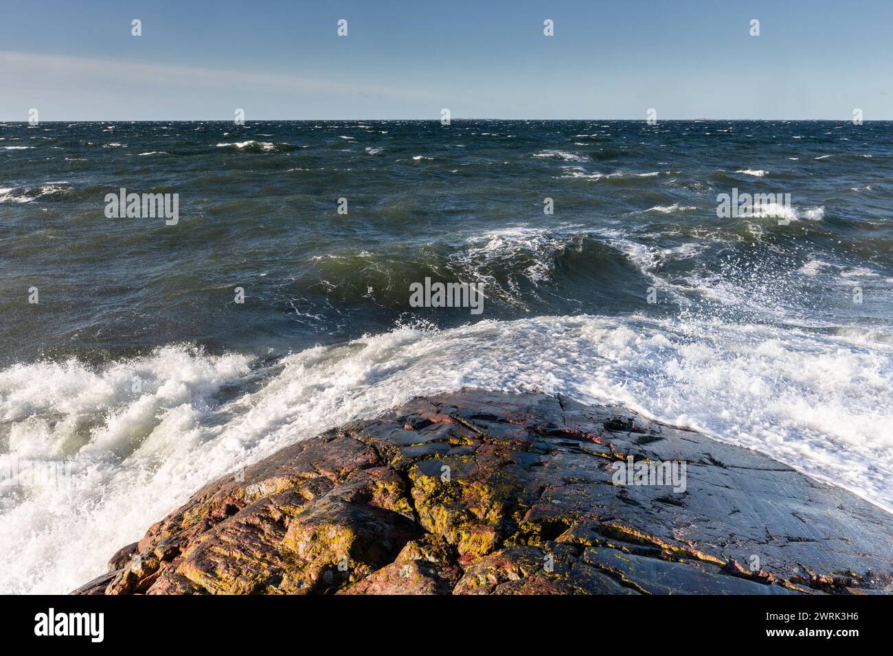 WAVES CRASH ON A REMOTE ISLAND PENINSULA, BALTIC SEA: Storm waves roll ...