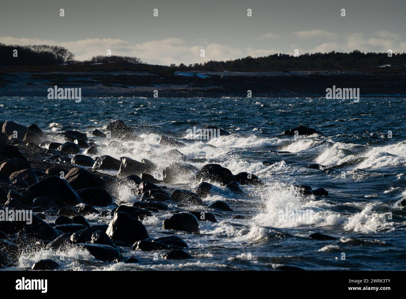 WAVES CRASH ON A REMOTE ROCKY BEACH, BALTIC SEA: Storm waves roll onto ...
