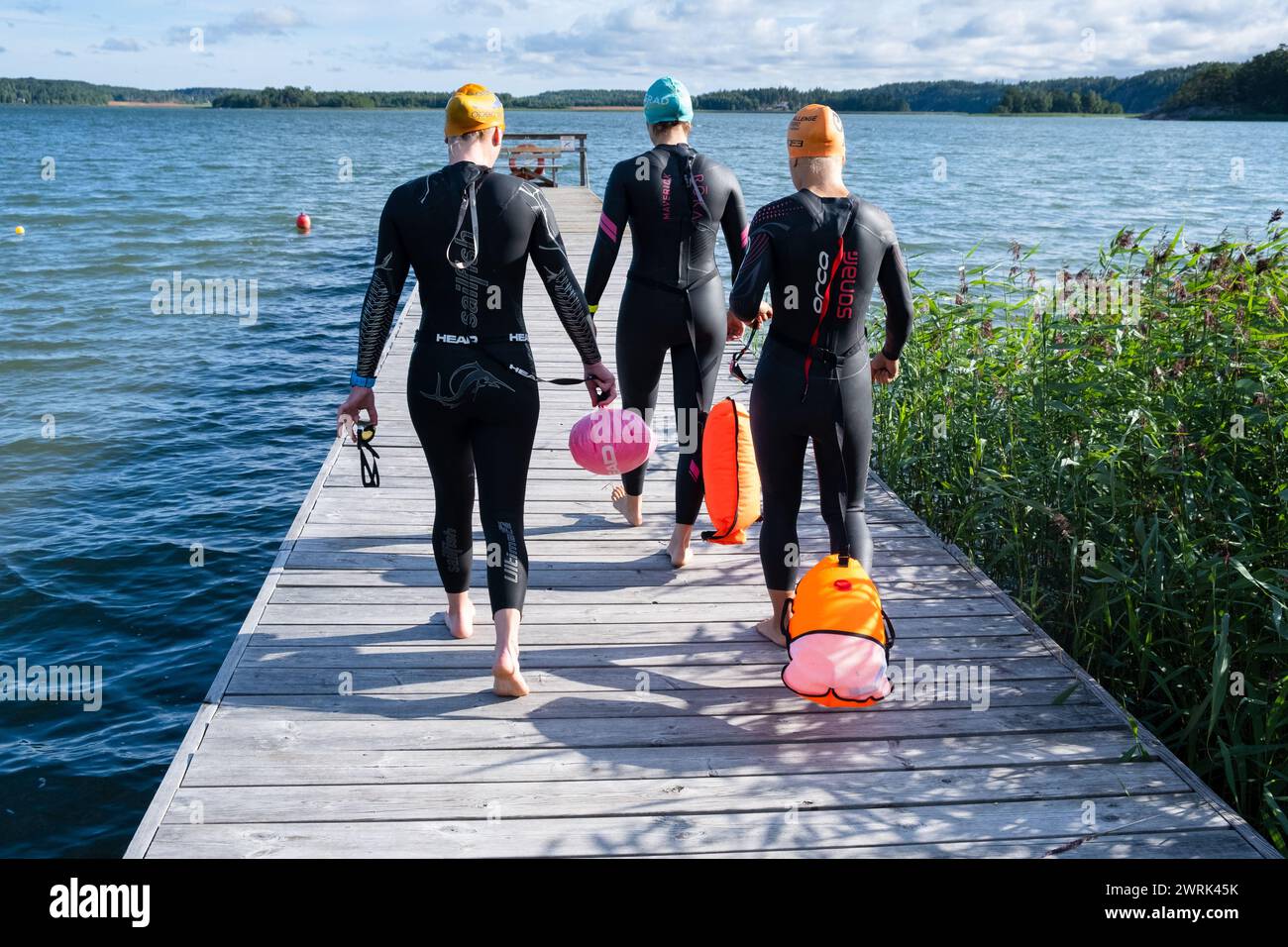 OPEN WATER SWIMMERS, ÅLAND, BALTIC SEA: Three women heading out for an ...