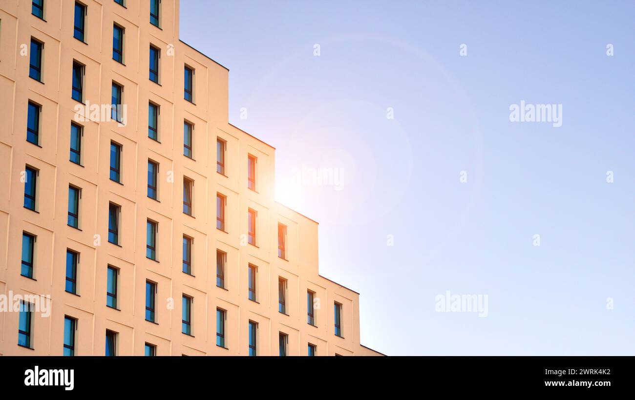 View of a white modern apartment building. Perfect symmetry with blue ...