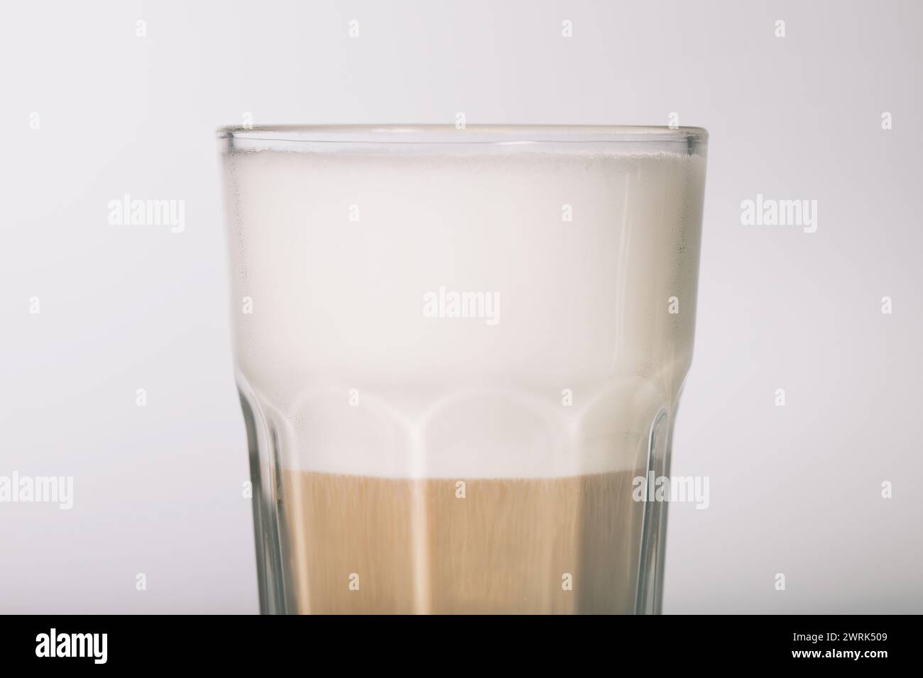 Preparing a caffe latte style hot drink from espresso and milk Stock ...