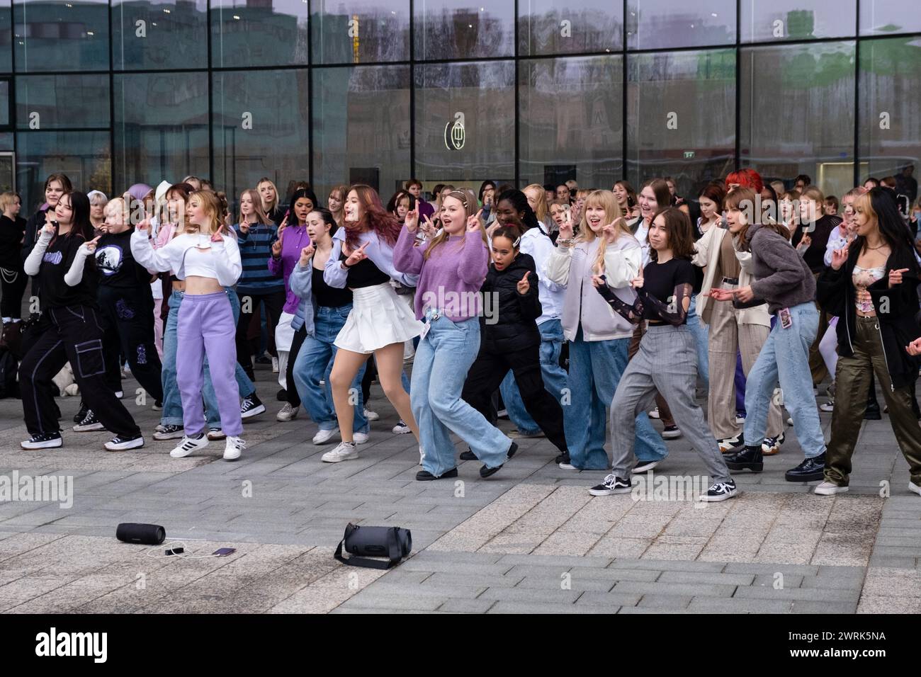 A large group of teenagers take part in the KPOP Random Play Dance ...