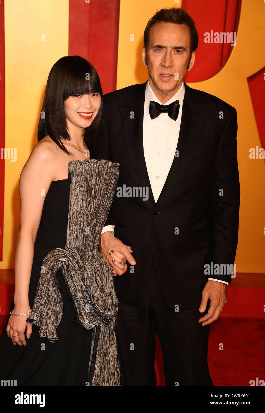 BEVERLY HILLS, CALIFORNIA - MARCH 10: (L-R) Riko Shibata and Nicolas Cage attend the 2024 Vanity ...