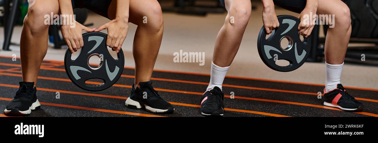 Women gym weight plates hi-res stock photography and images - Alamy