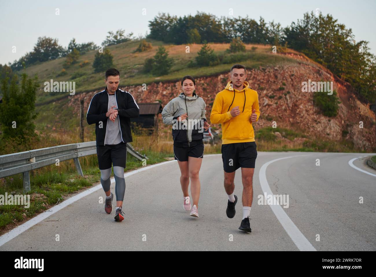 Running towards a common goal, a group of colleagues braves the misty ...