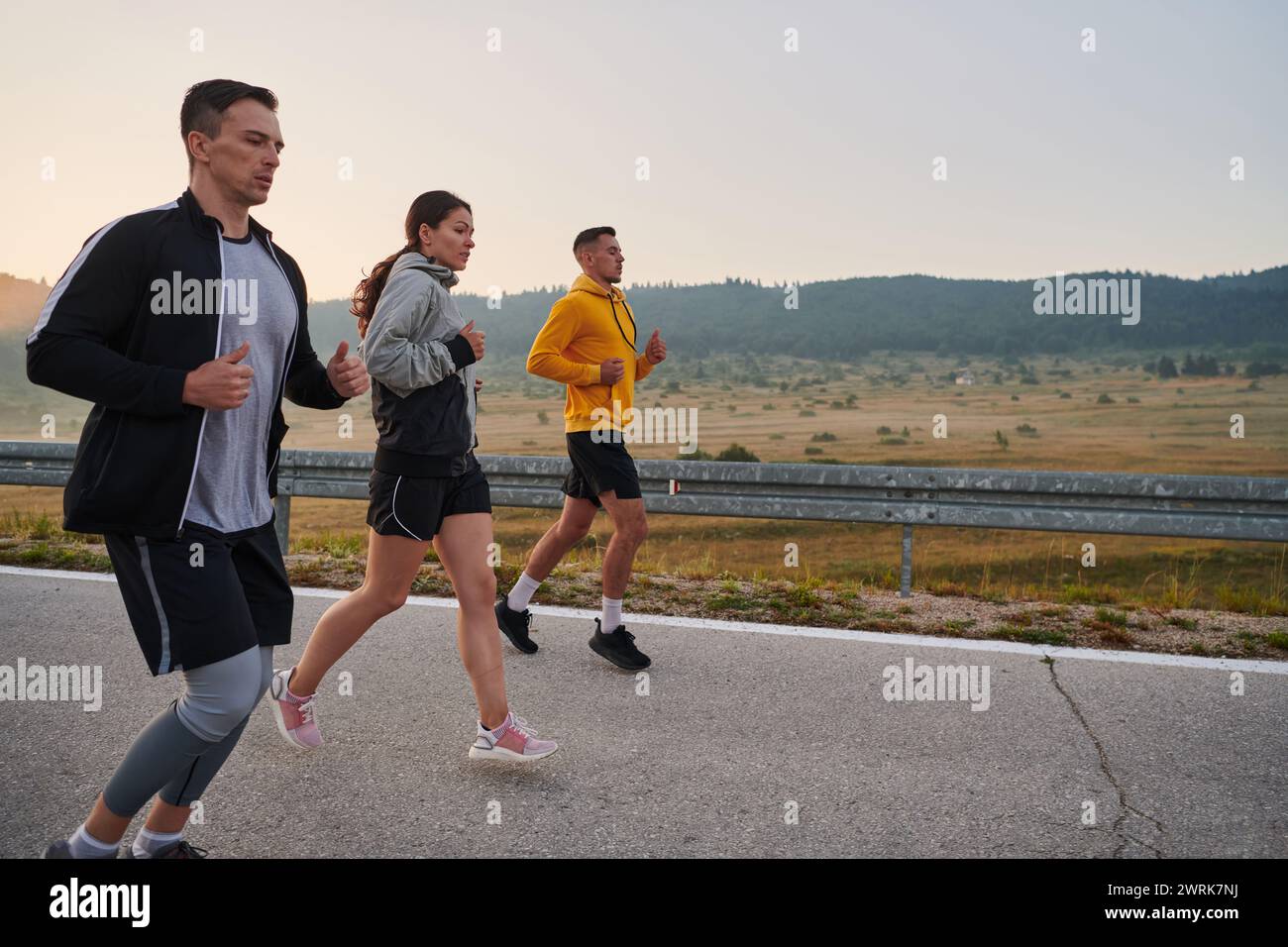 Running towards a common goal, a group of colleagues braves the misty ...