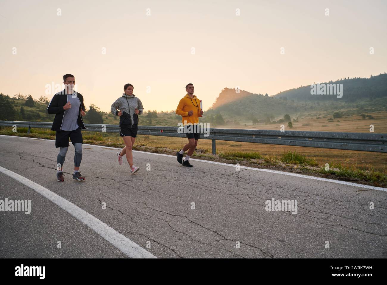 Running towards a common goal, a group of colleagues braves the misty ...