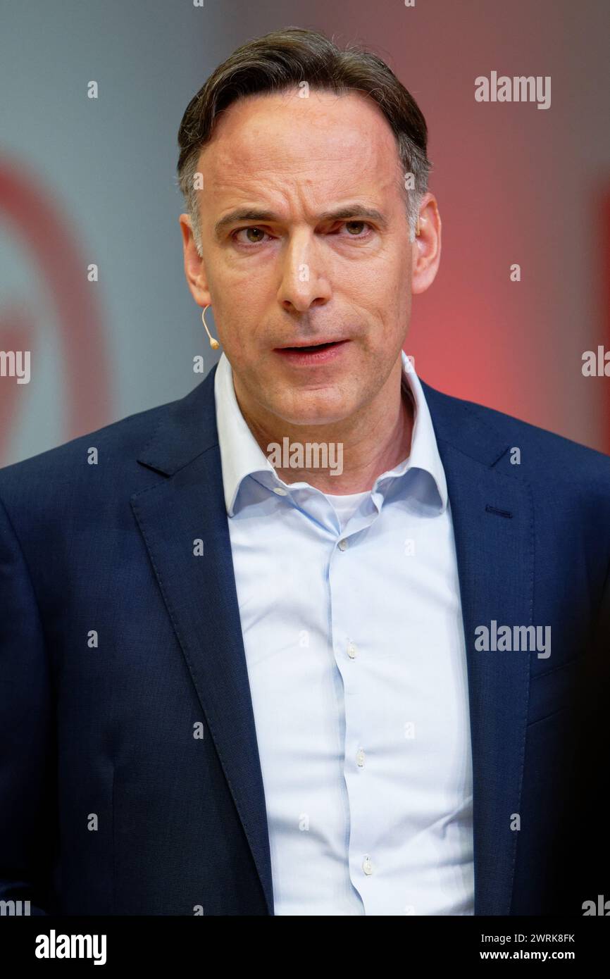 Essen, Germany. 13th Mar, 2024. Eon CFO Marc Spieker on the podium at Eon SE's annual press ...