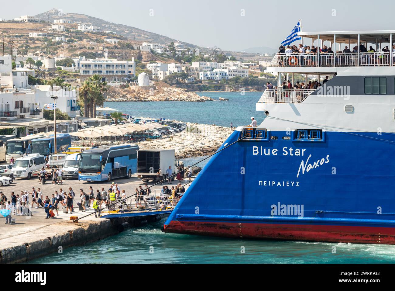 Tourists disembarking ship of Blue Star Ferries Greek passanger transportation company providing ...