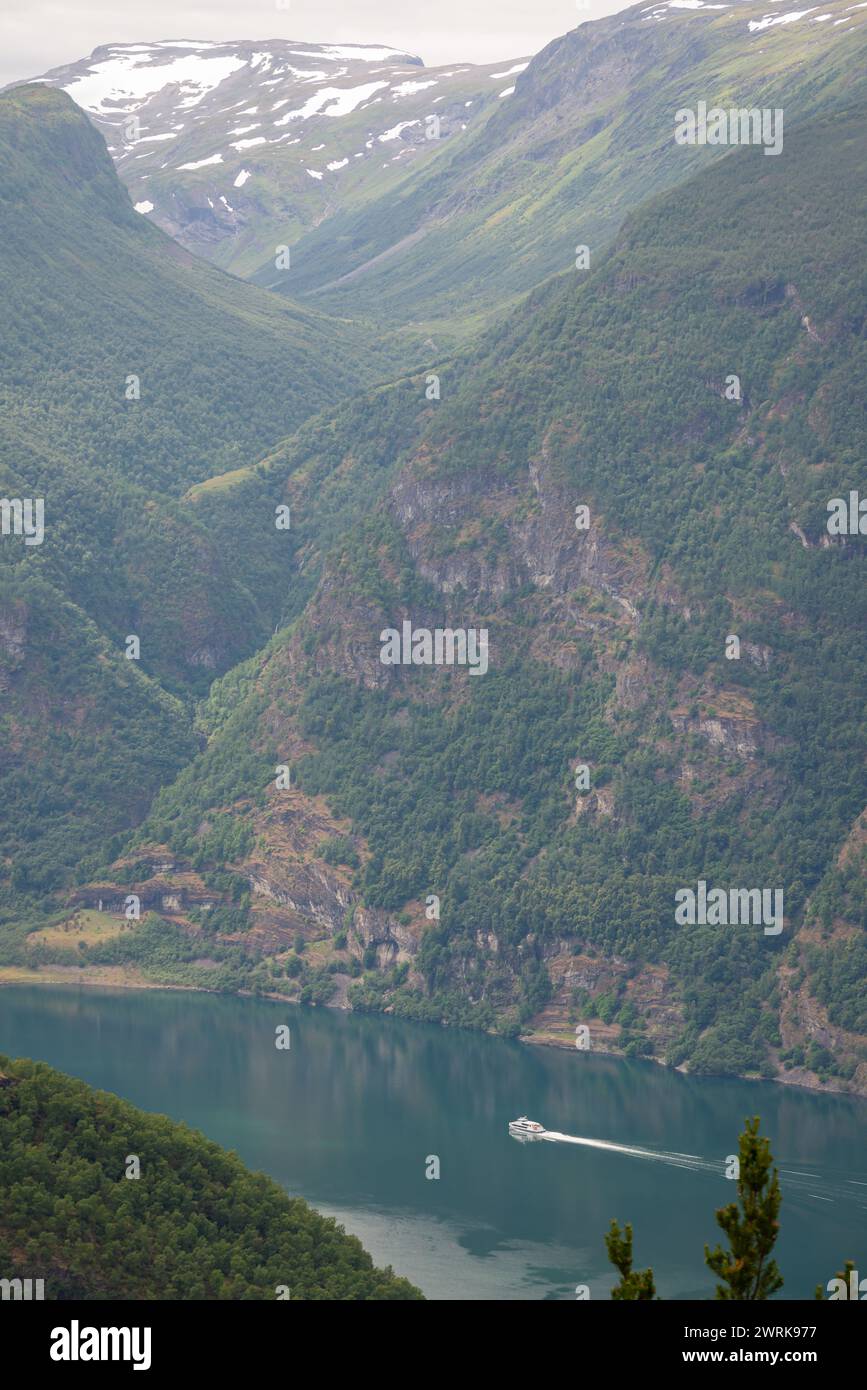 view of a Norwegian mountain river with clear blue water, on which a ...