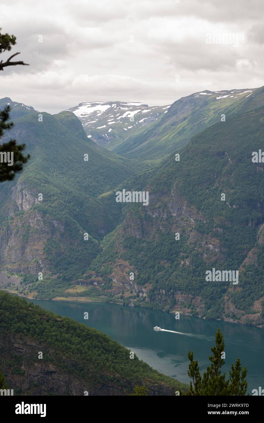 view of a Norwegian mountain river with clear blue water, on which a ...