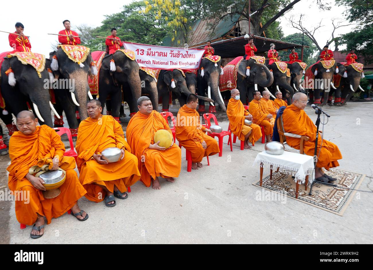 Ayutthaya, Thailand. 13th Mar, 2024. Buddhist monks sit in front of the ...
