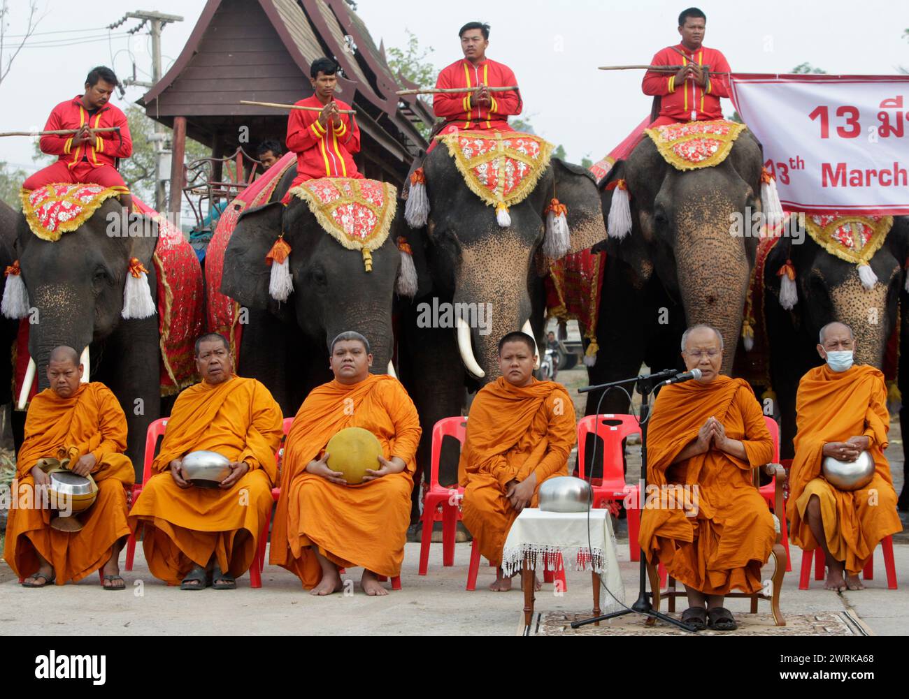 Ayutthaya, Thailand. 13th Mar, 2024. Buddhist monks sit in front of the ...