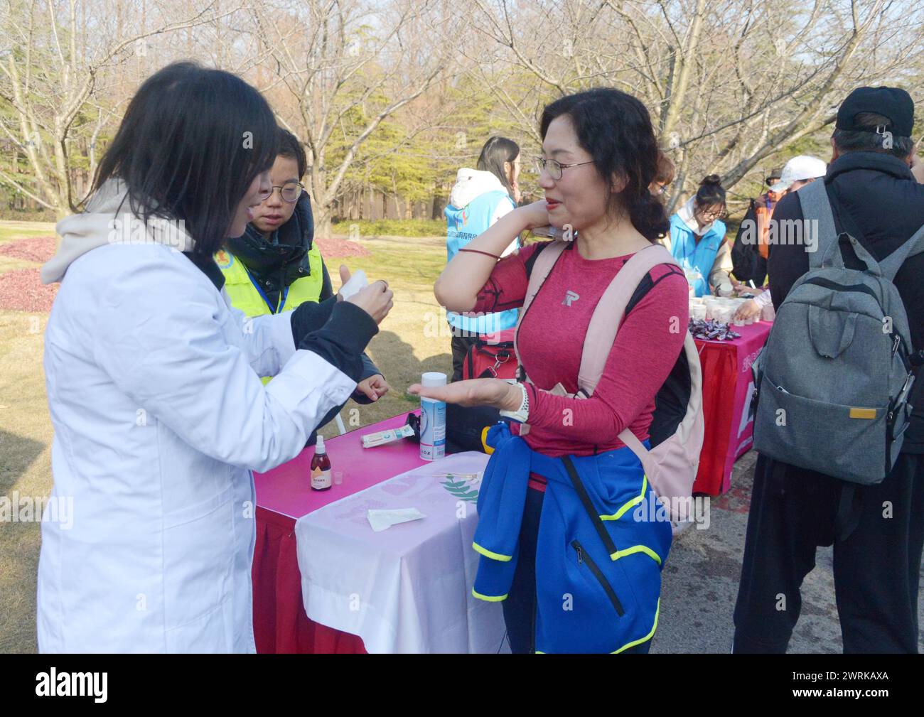 Runners participate in a women's 10km race at Gucun Park in Shanghai ...