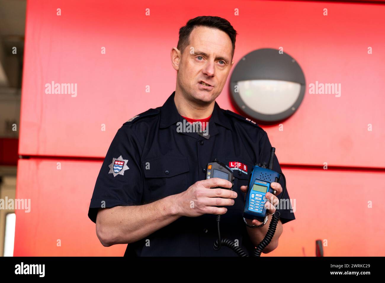 A London Fire Brigade firefighter operates new communication apparatus ...