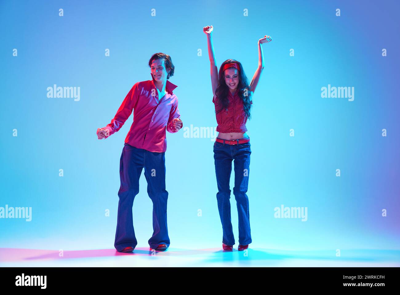 Rock and roll era. Elegant stylish young couple dancing retro dance ...
