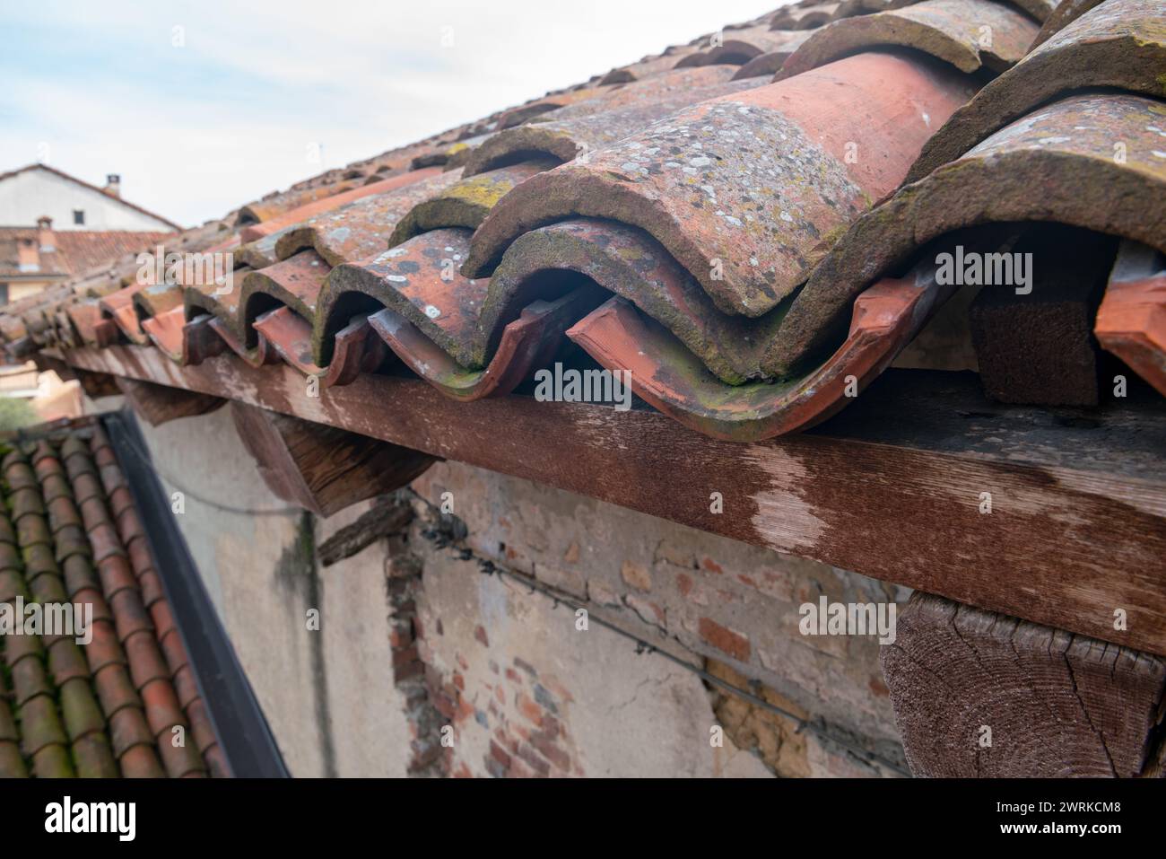 tiled roof supported on a double pitch roof, the old tiles tend to slip ...