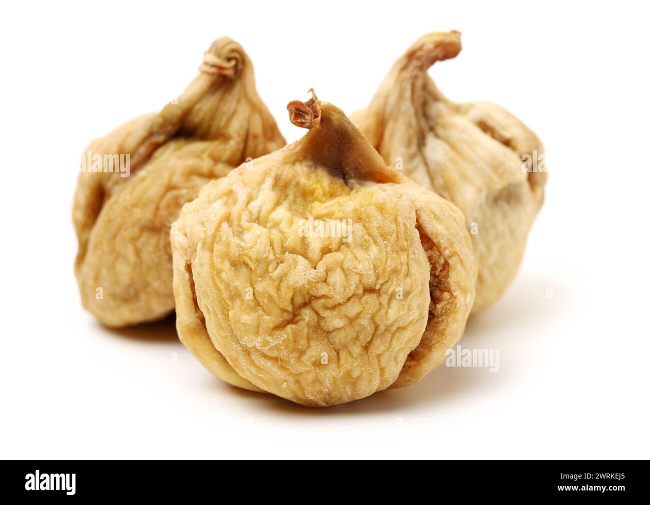 dried fig on white background Stock Photo - Alamy