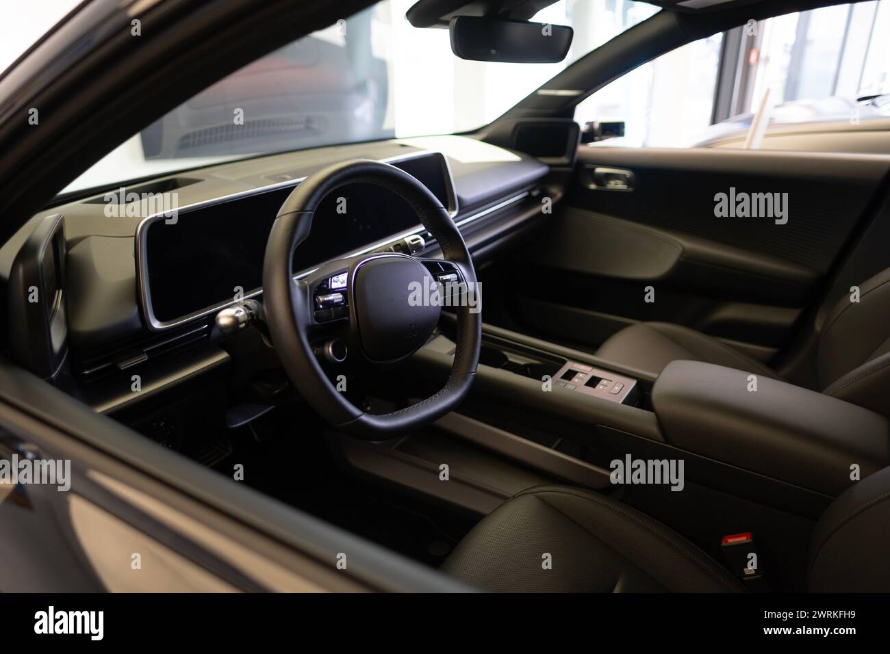 Interior, cockpit of electric streamliner Hyundai IONIQ 6 car, digital ...