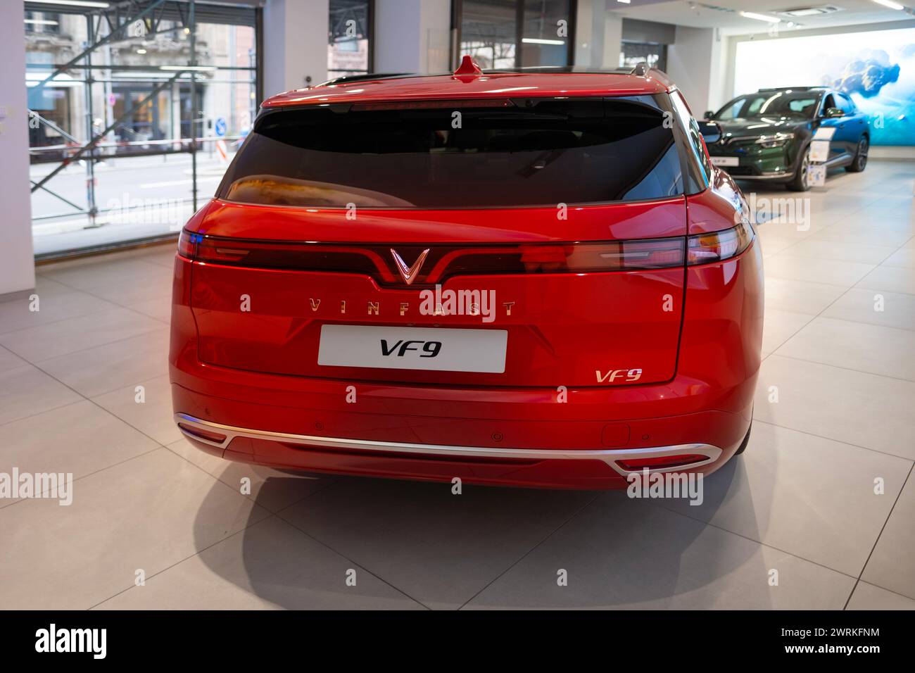 new red Vinfast vf 9 electric SUV in Studio, advanced technologies in ...