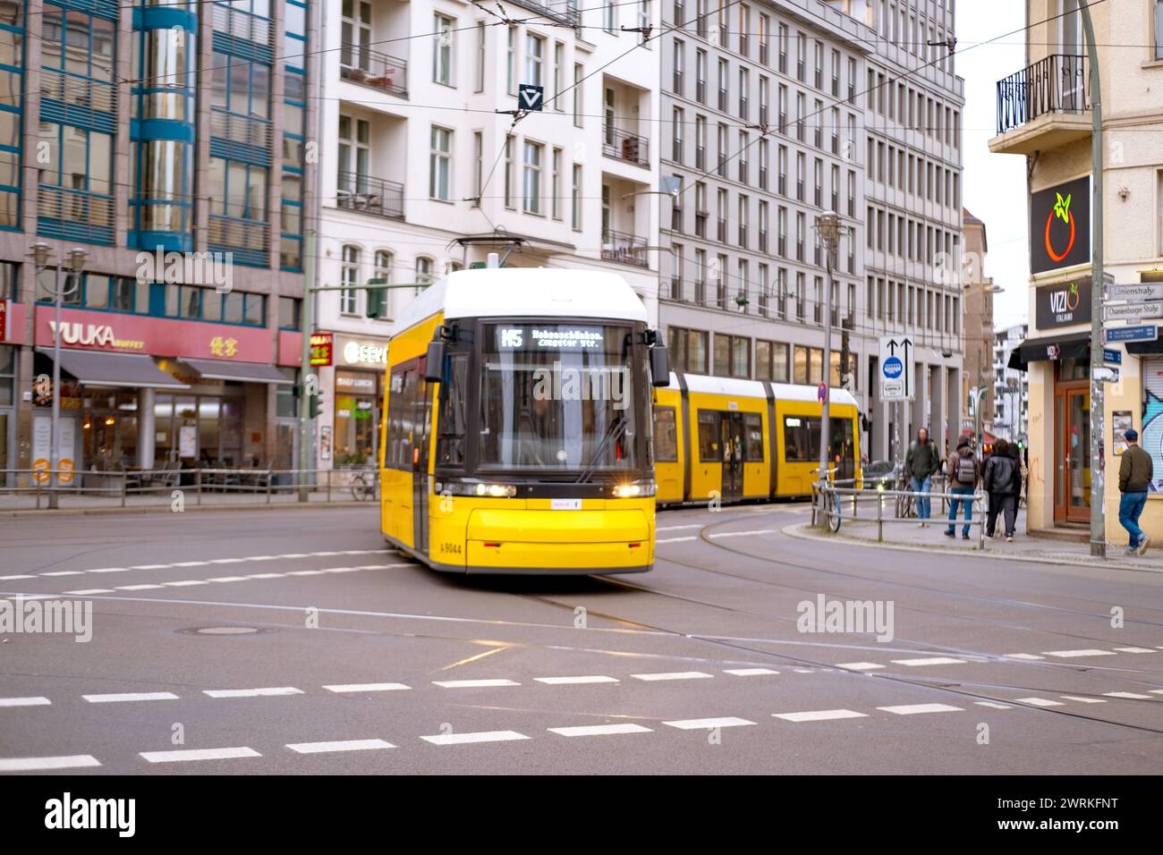yellow tram Flexity Berlin driving down city street in Berlin, travel ...