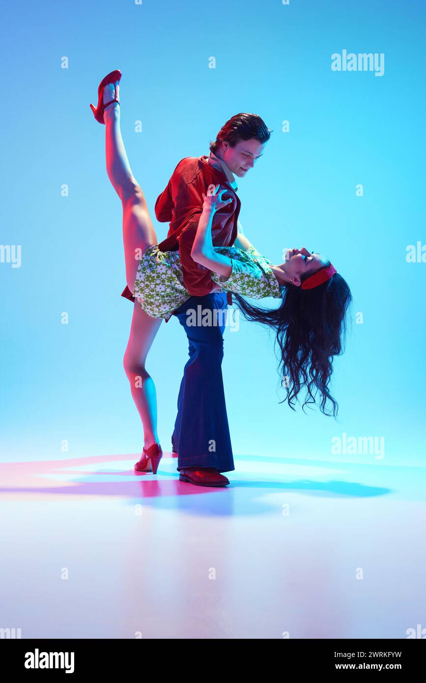 Poster for retro dance festival. Young stylish man and woman dancing ...